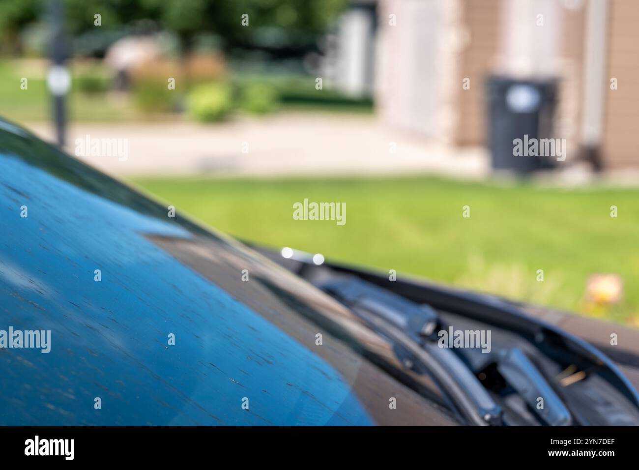 Smeared and dirty front windshield of a vehicle after hitting bugs ...