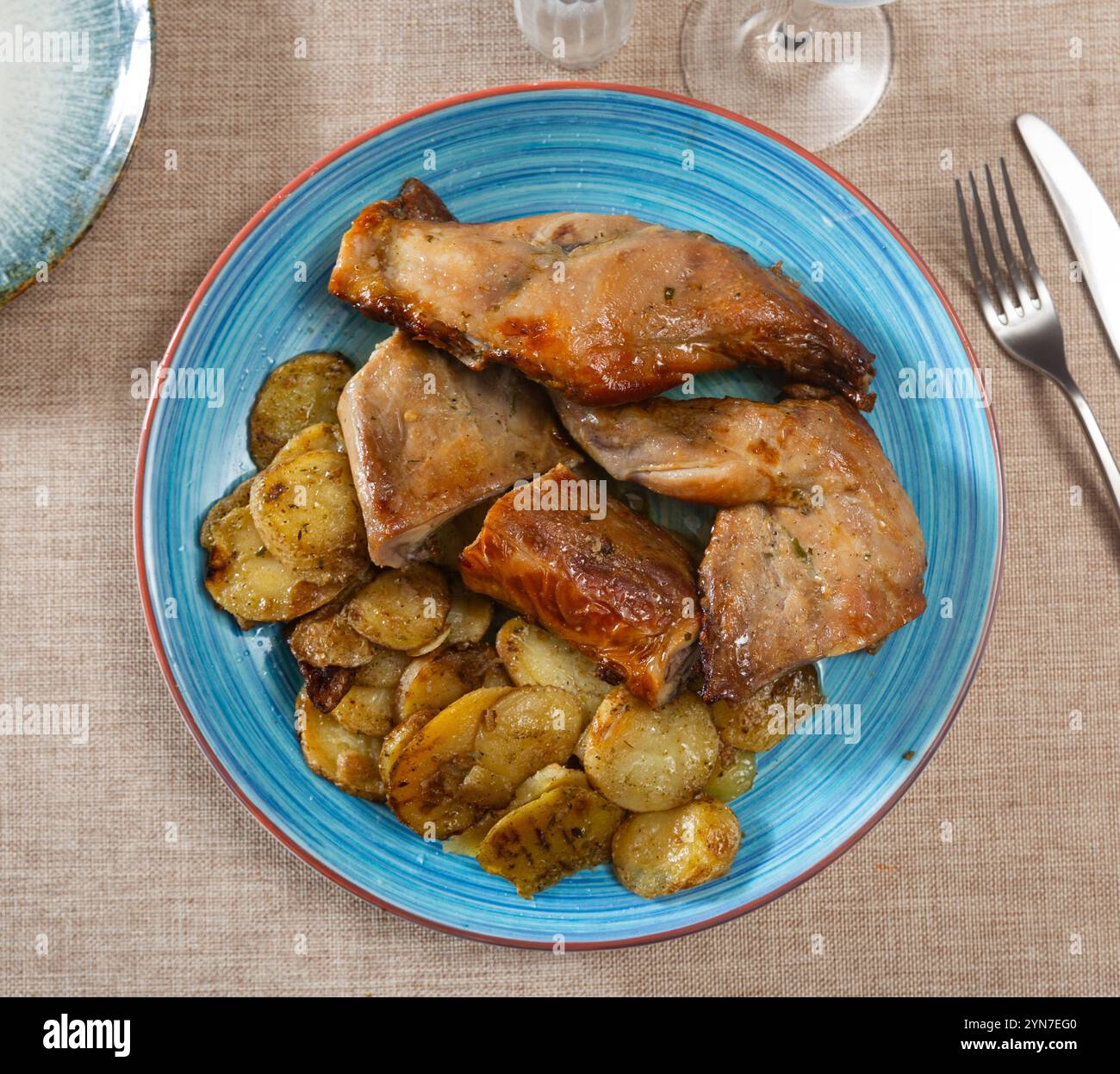 Baked rabbit with potatoes Stock Photo - Alamy