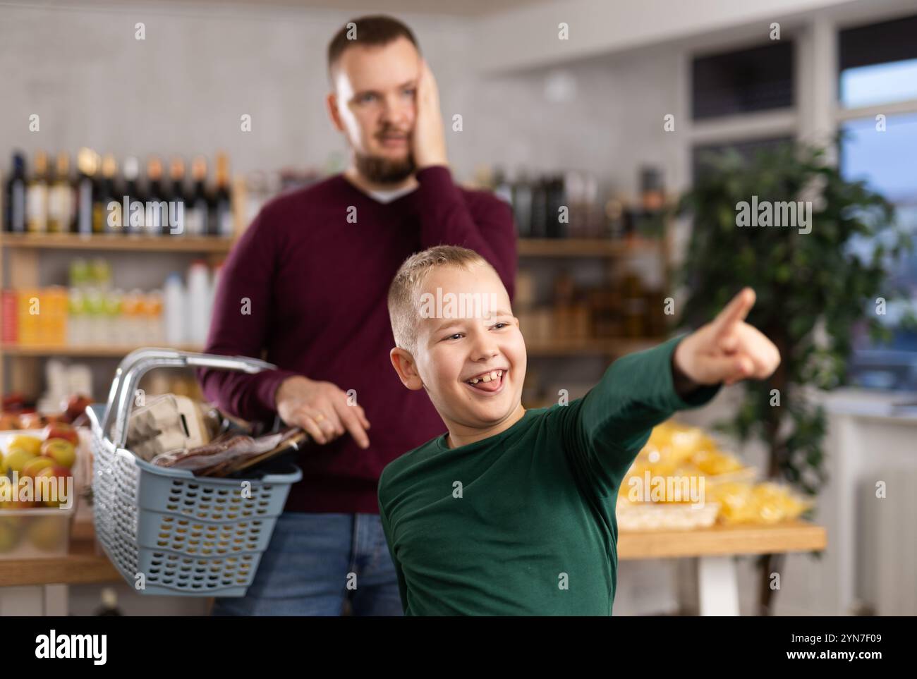 Little boy behaving capricious in grocery store Stock Photo - Alamy