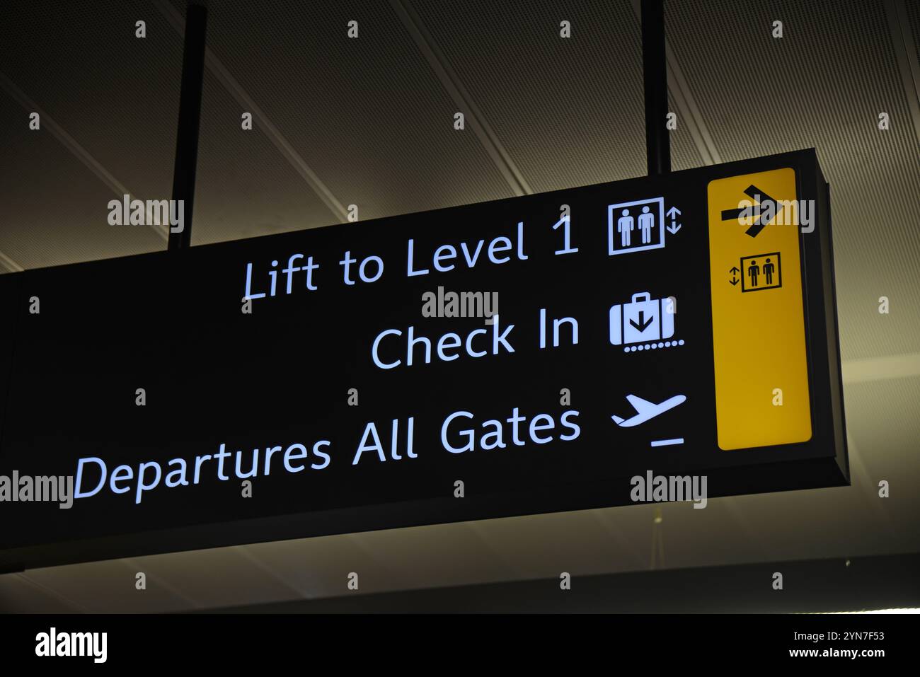 Airport signage for lifts, check in and departures Stock Photo - Alamy