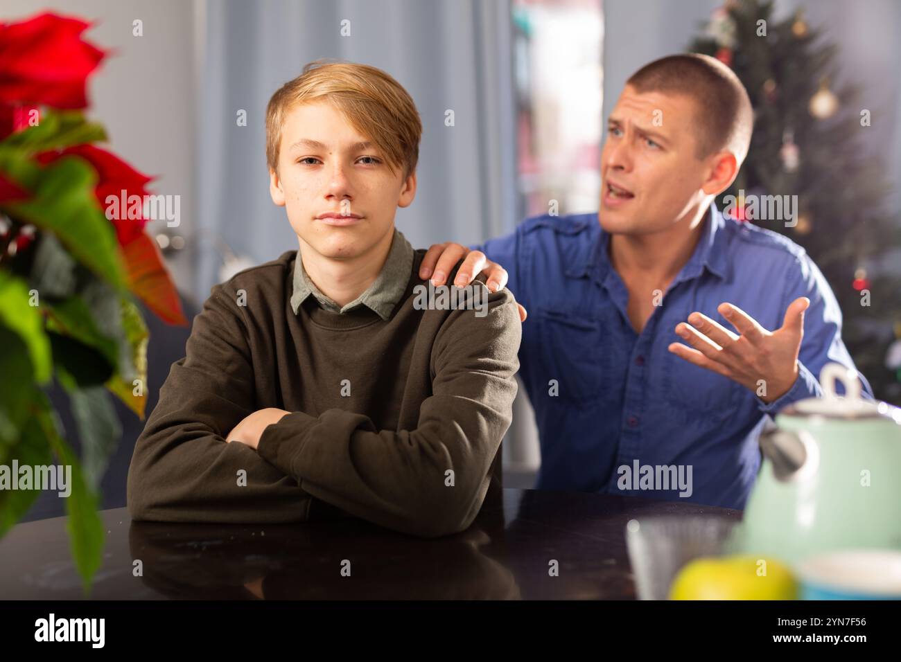 Man scolding his son before Xmas Stock Photo - Alamy