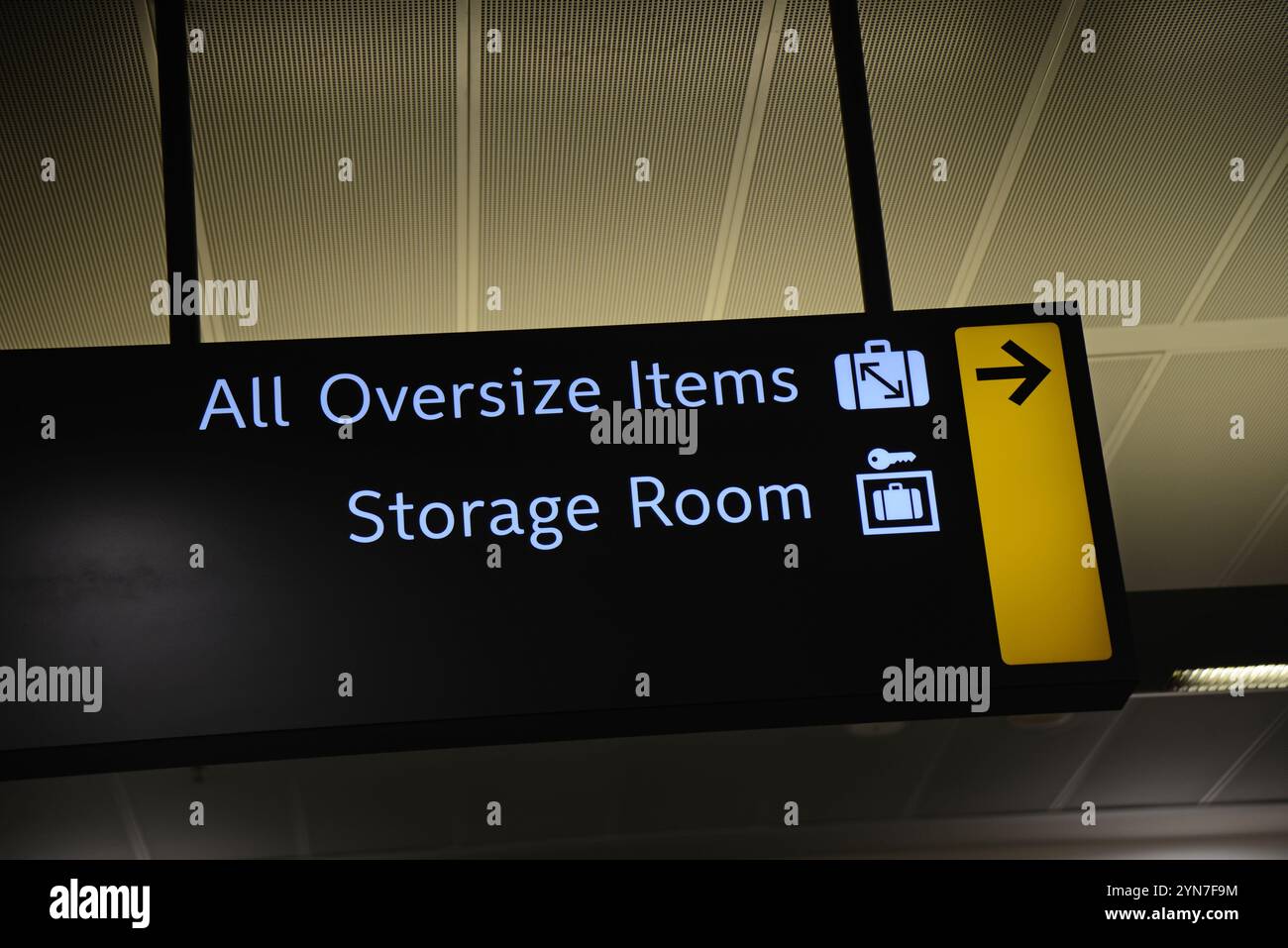 Airport signage for oversize items and storage Stock Photo - Alamy