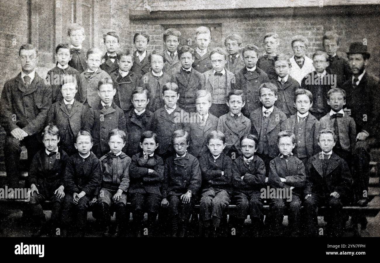 A George Watkins Holden class photo of young pupils with their teachers ...