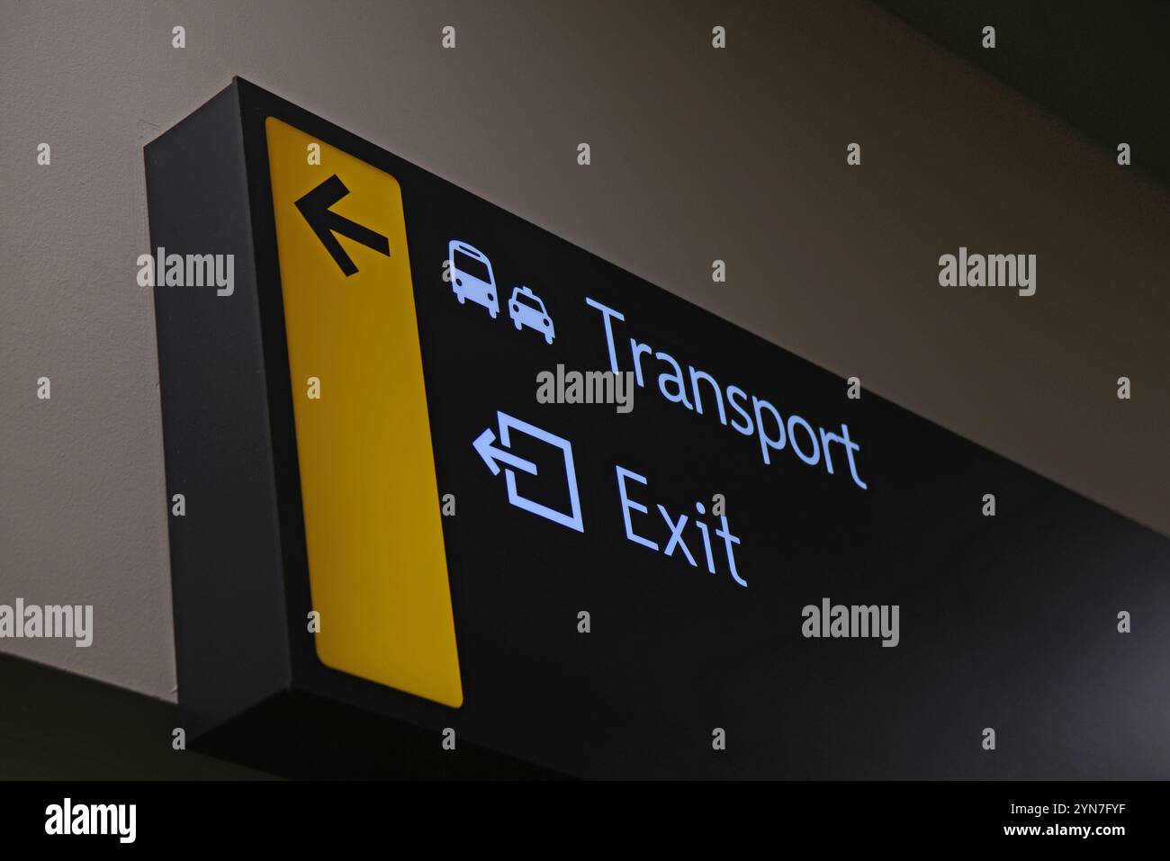 Airport signage for the exit to buses and taxis Stock Photo - Alamy