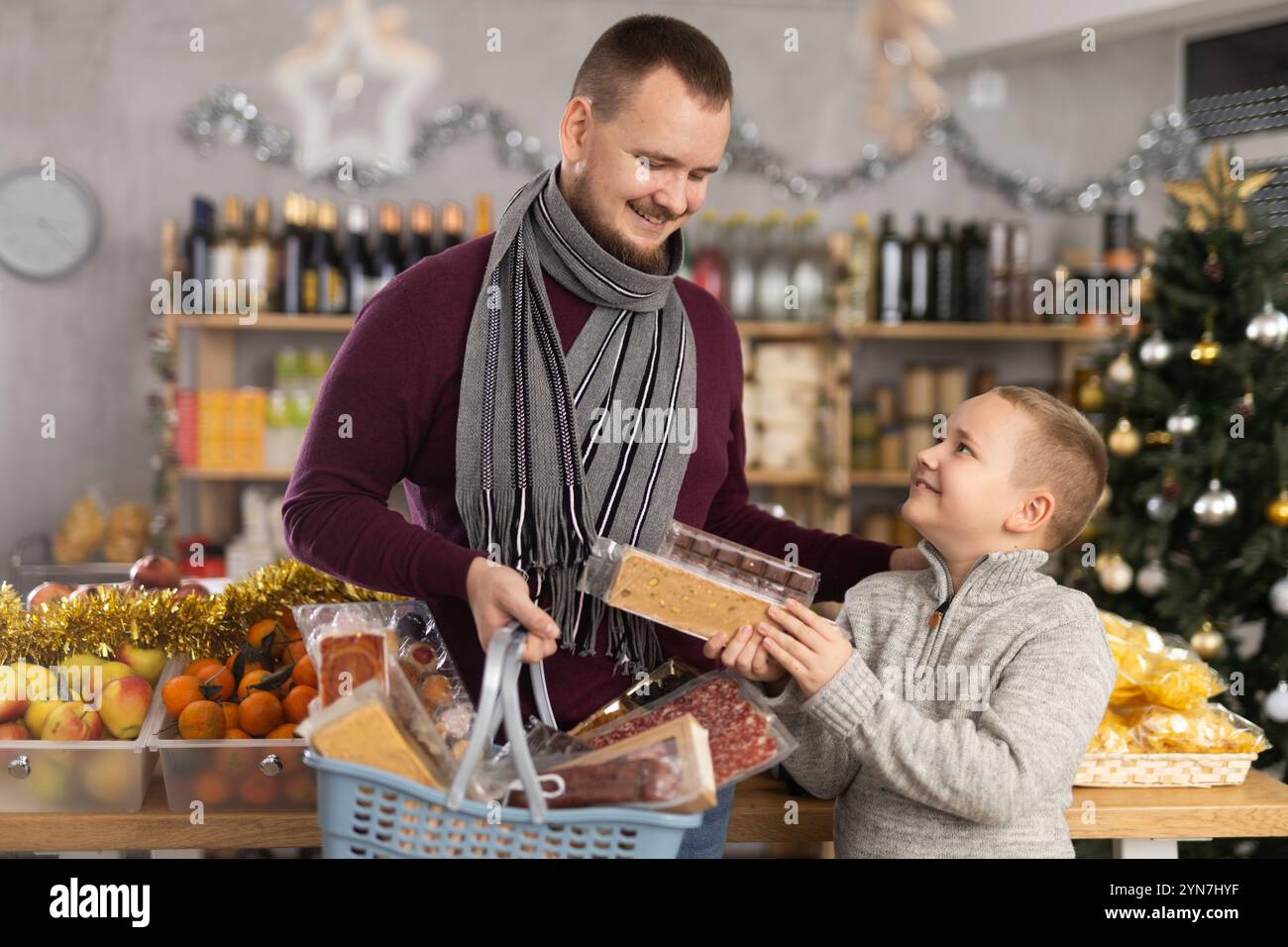 Son and dad choose sweets Stock Photo - Alamy