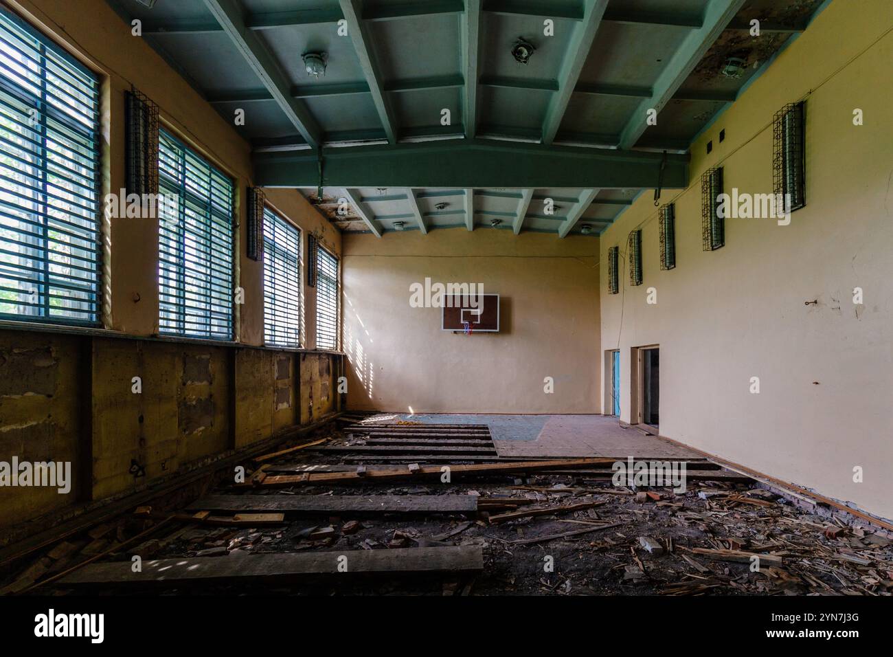 Dark creepy ruined gymnasium in abandoned school Stock Photo - Alamy