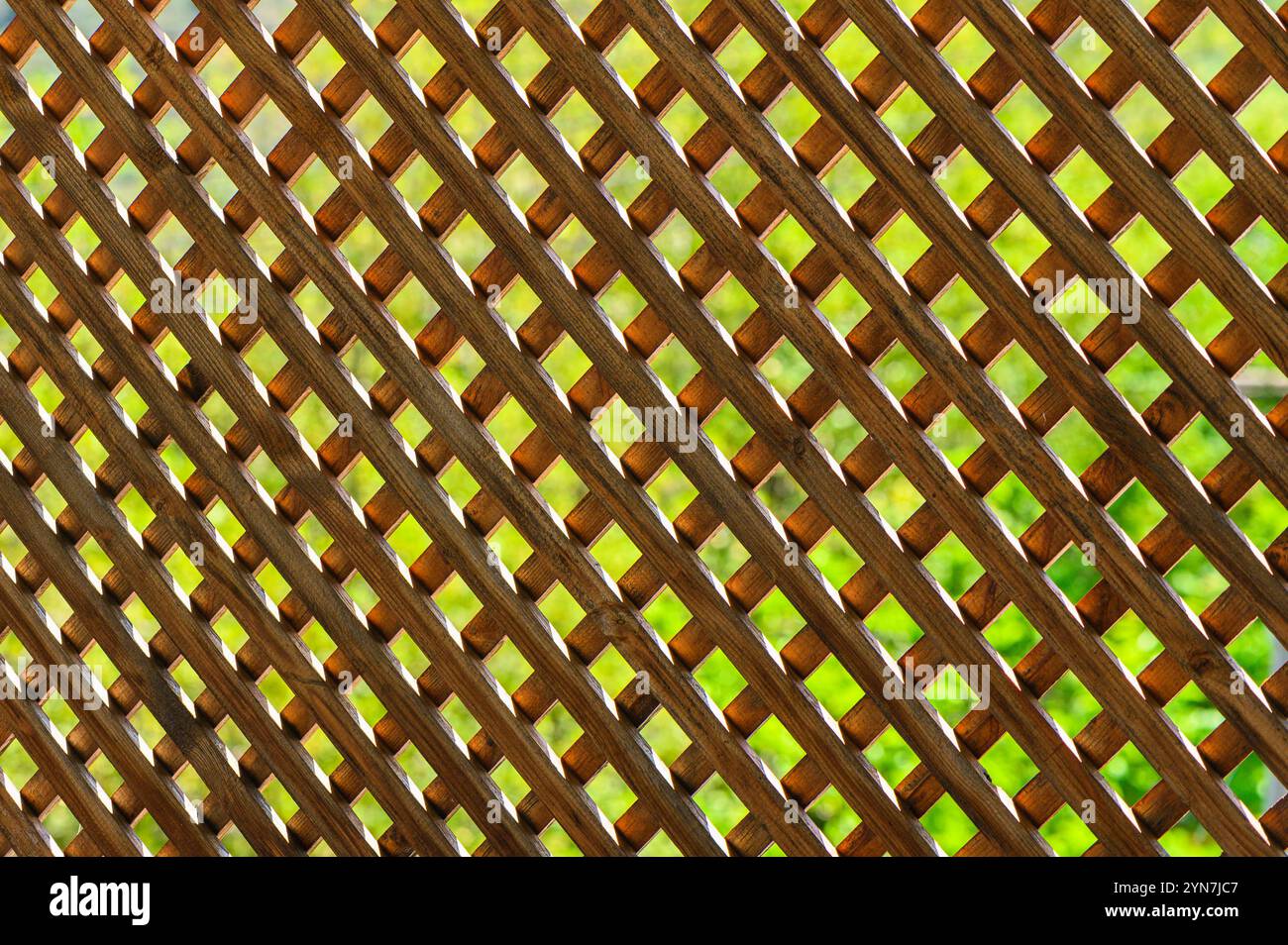 A beautifully crafted wooden lattice creates patterns of light and ...