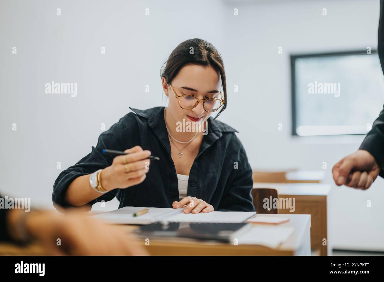 High school student focused on work in a classroom setting Stock Photo ...