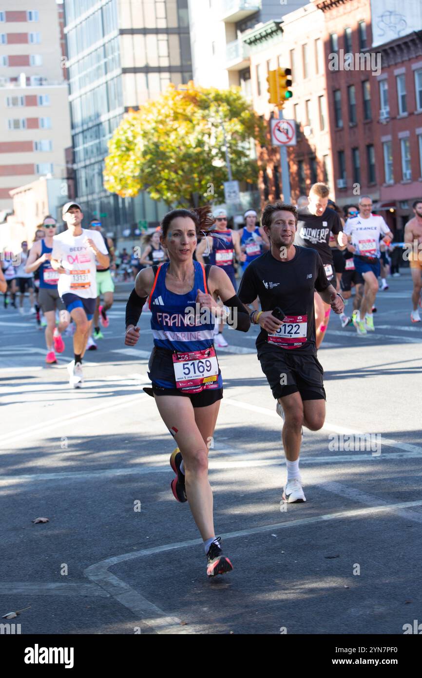 Runners moving along 4th Avenue in the Park Slope neighborhood of ...