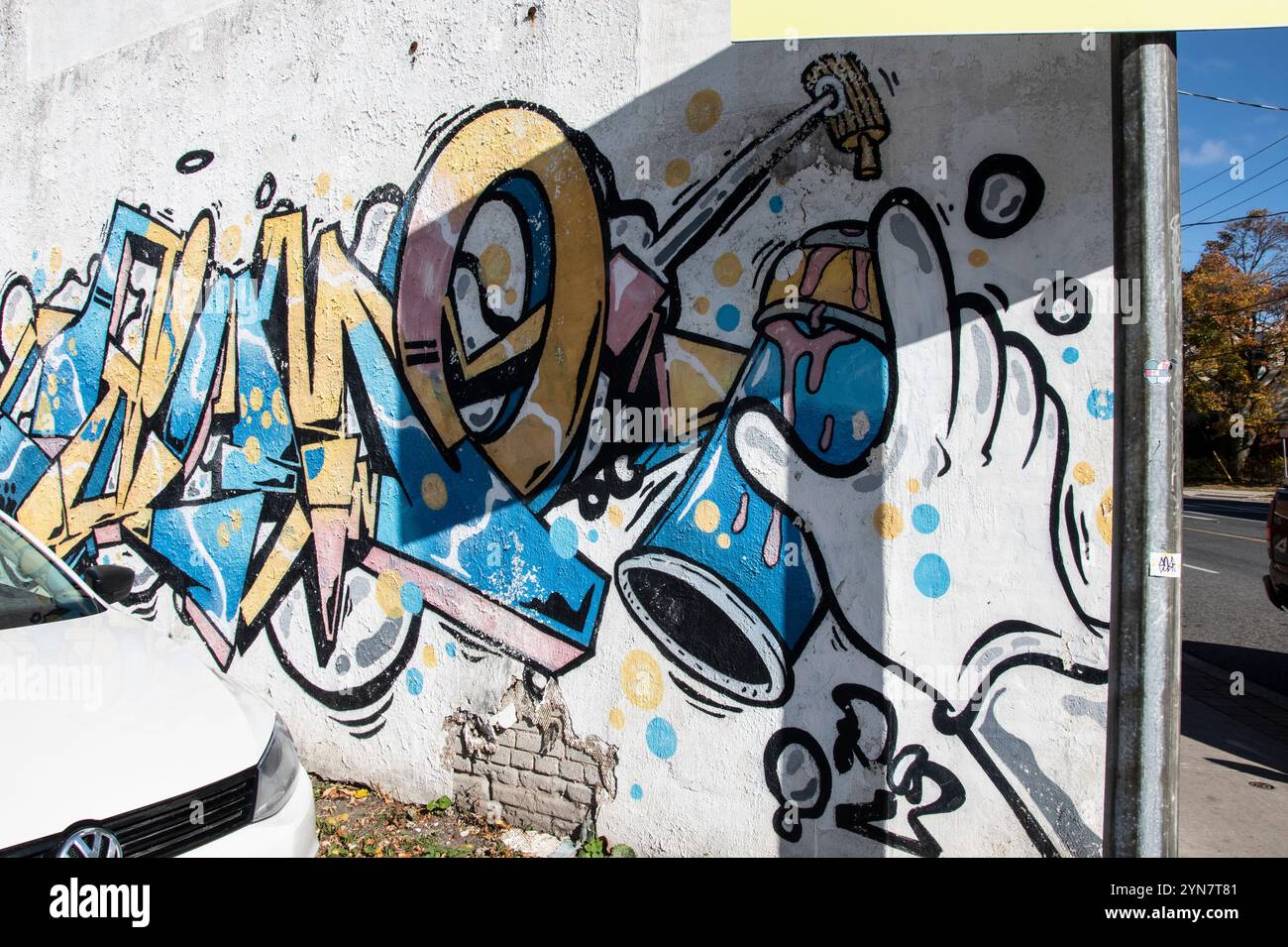 Graffiti artist painting mural on Kingston Road in Scarborough, Toronto ...