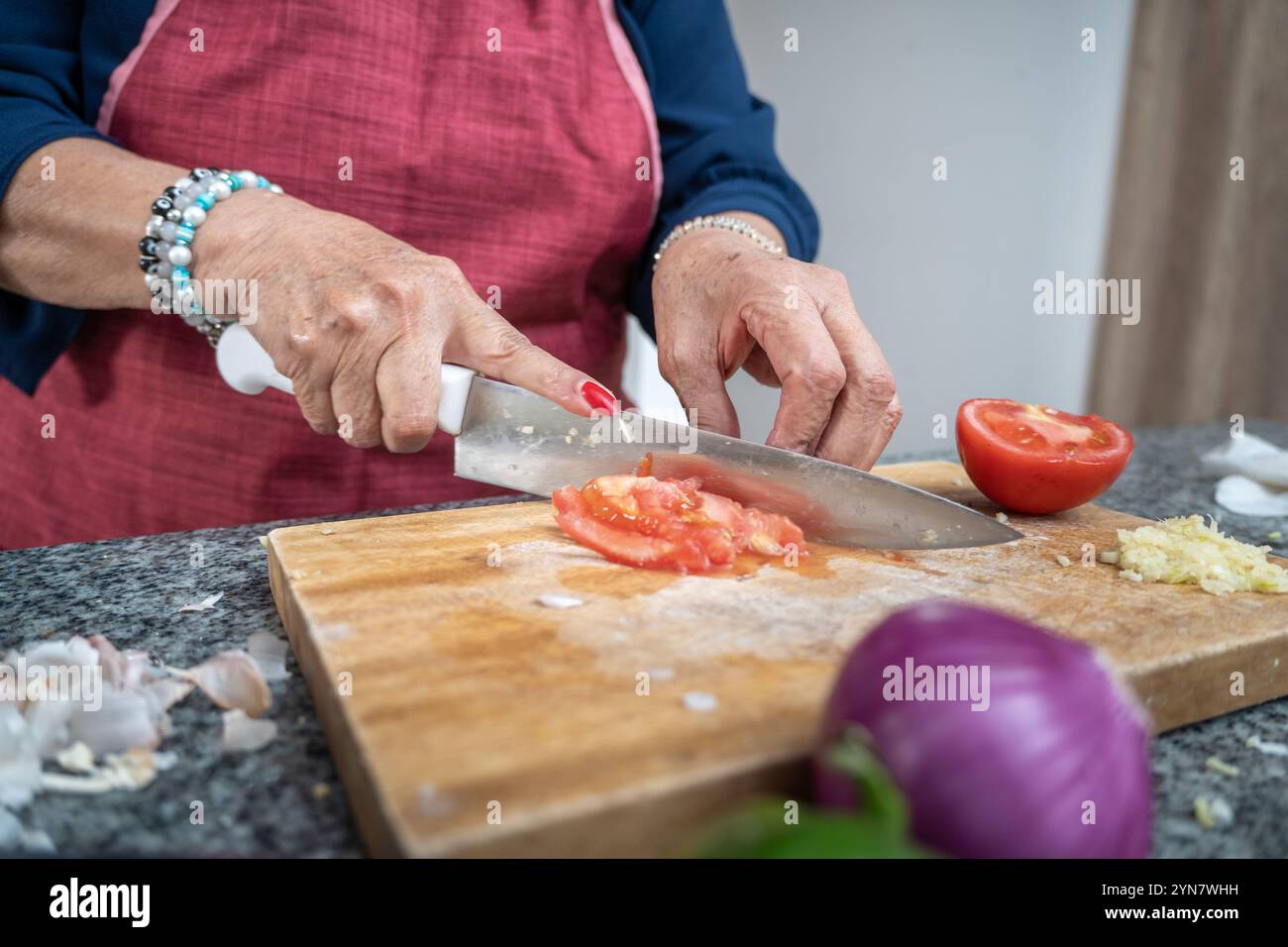 Female hands cutting tomato knife hi-res stock photography and images ...