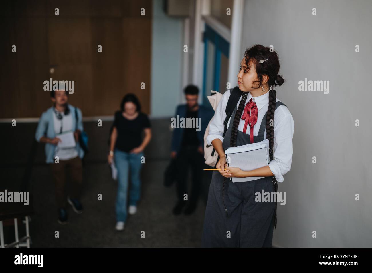 Students walking in hallway together illustrating academic environment ...