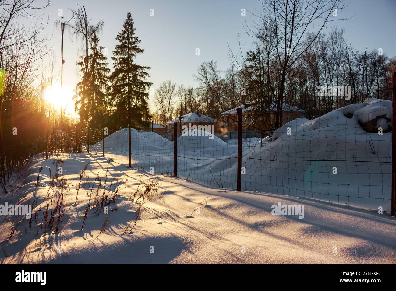 Mesh fence enclosing a construction site in the winter season Stock ...