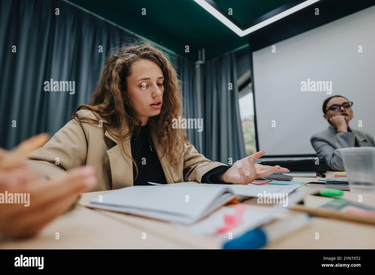 Focused students engaged in a classroom discussion setting Stock Photo ...