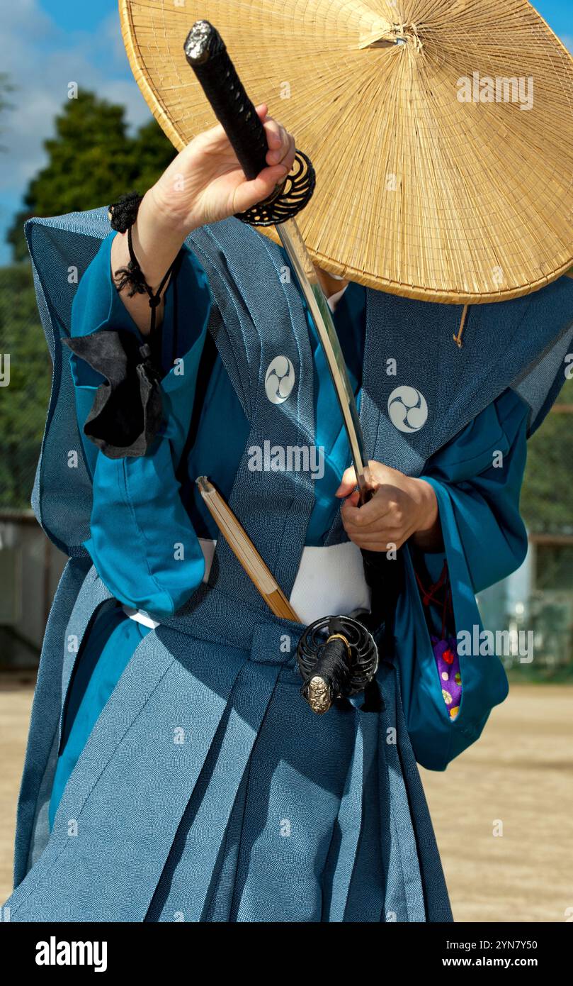 Samurai warrior holding a katana sword while in costume at the Hikone ...