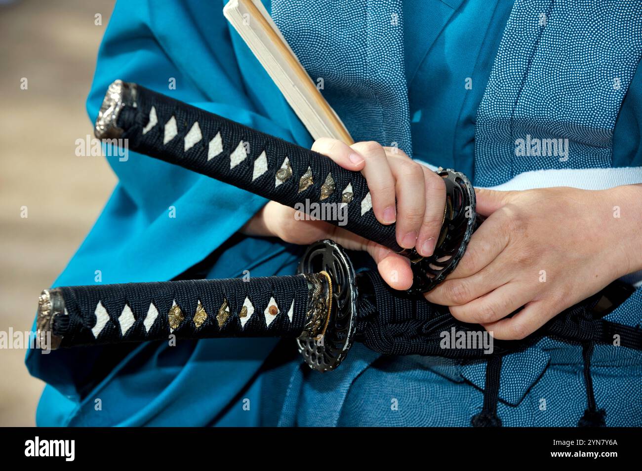 Samurai warrior holding a katana sword while in costume at the Hikone ...