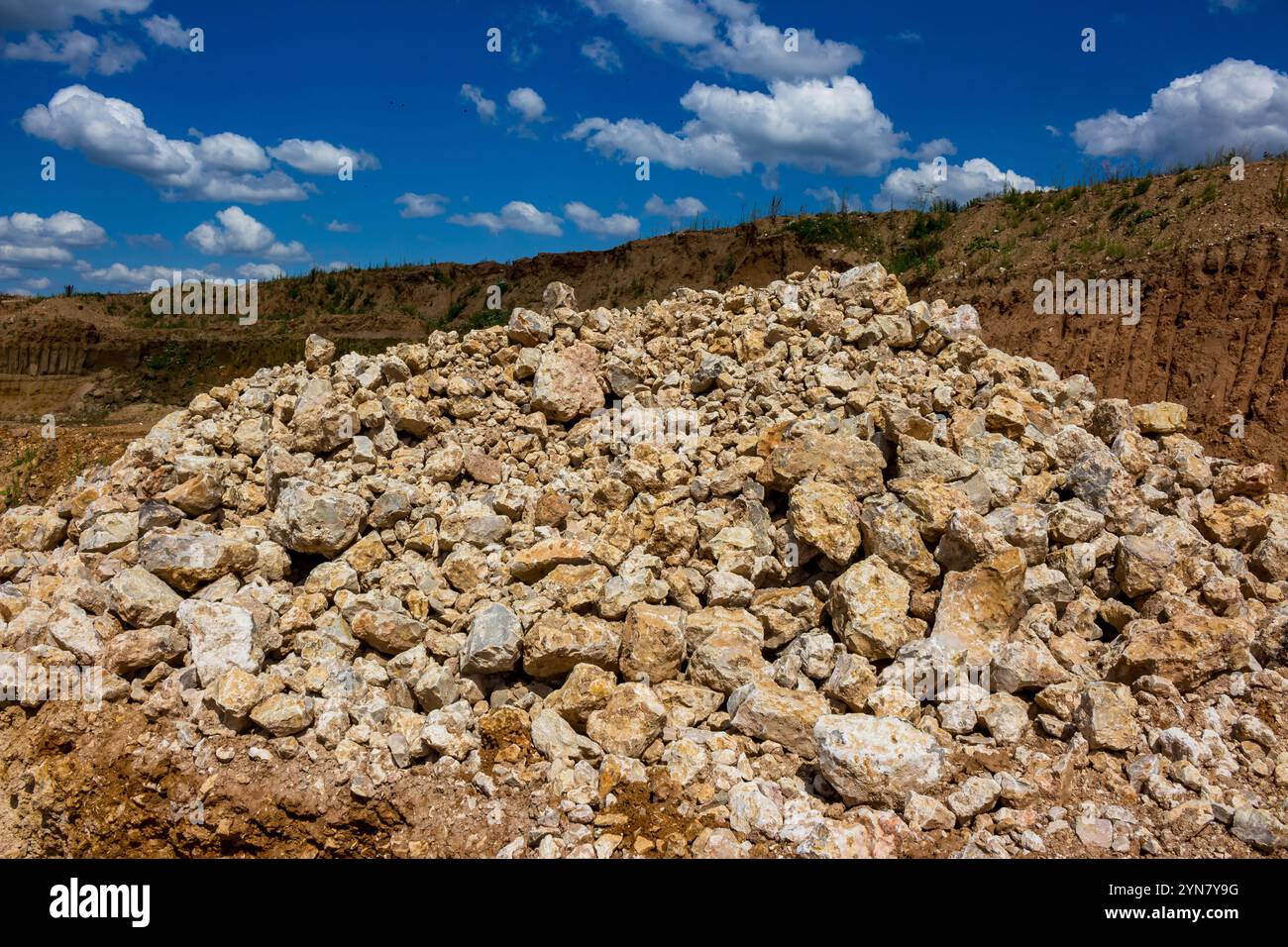 Mound of extracted limestone rock at a gravel pit. Kaluga region ...