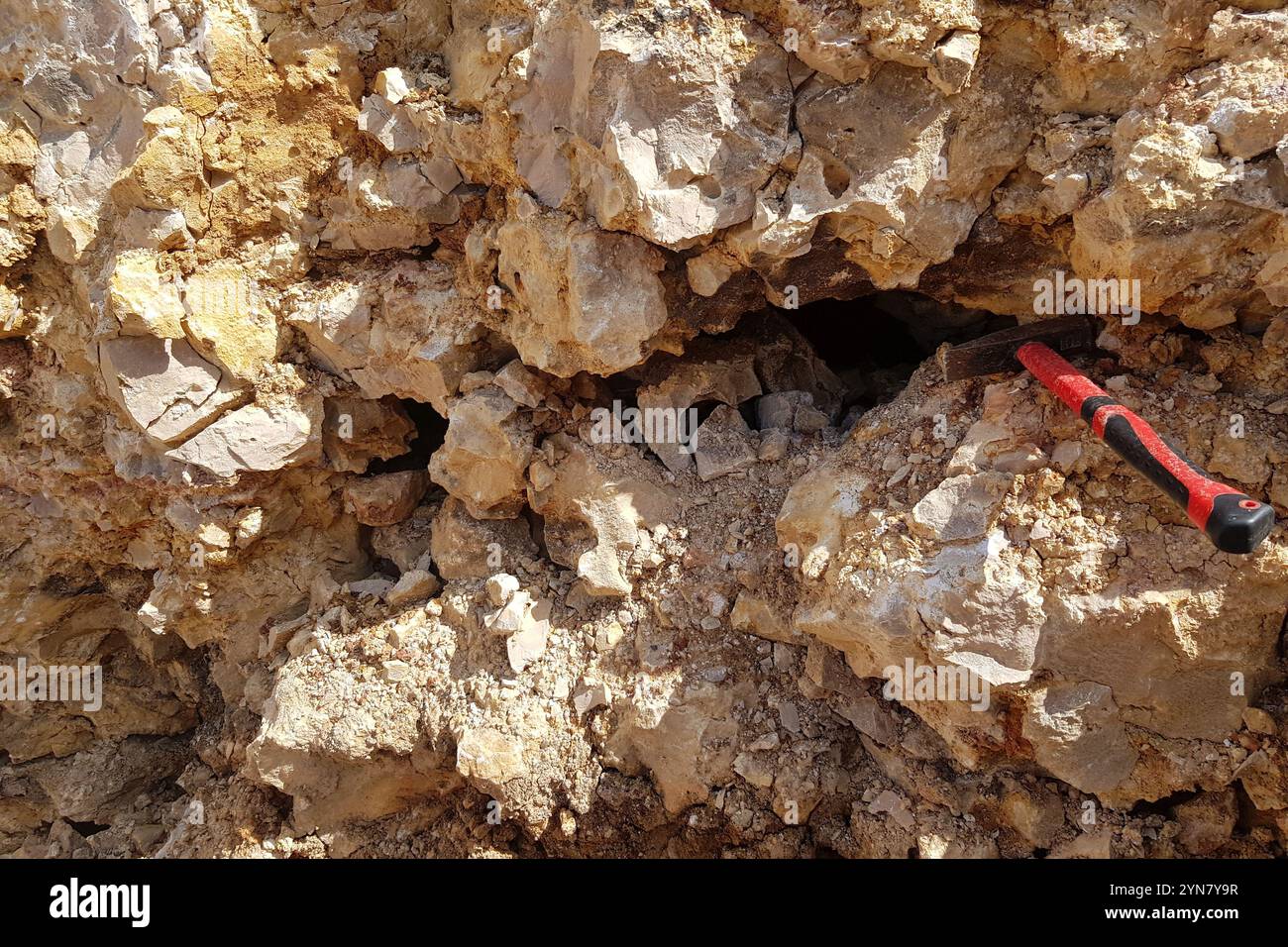 Karst cavity in a fractured limestone rock outcrop. Kaluga region ...