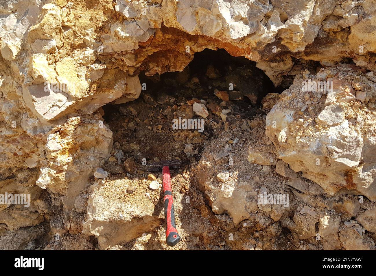 Karst cavity in a fractured limestone rock outcrop. Kaluga region ...