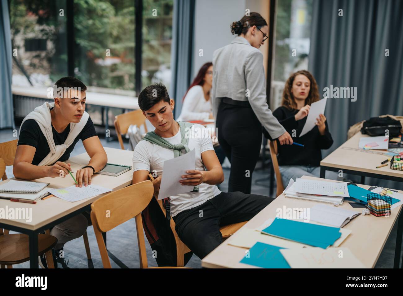 Students engaged in a collaborative learning environment at school ...