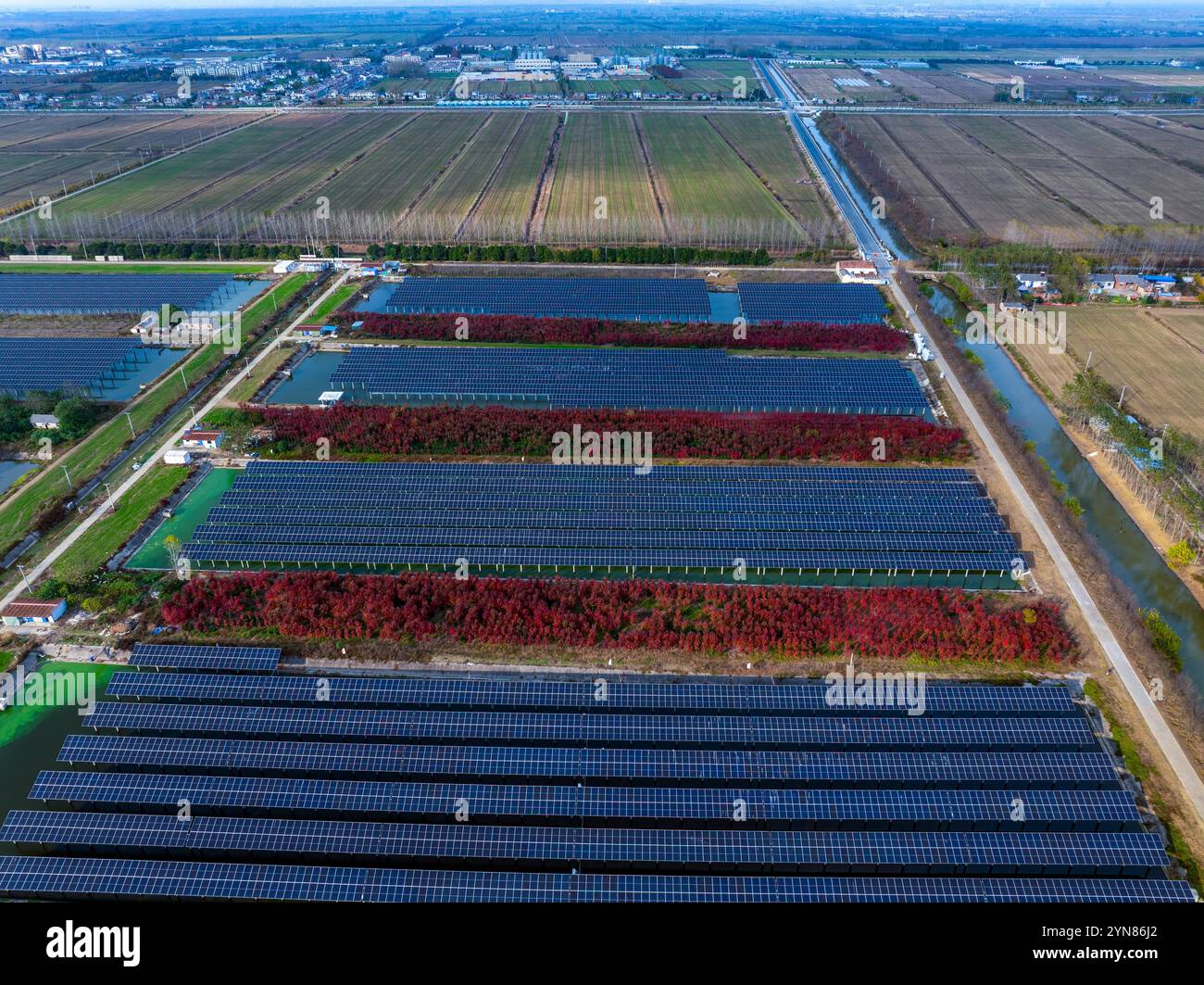 HUAI'AN, CHINA - NOVEMBER 24, 2024 - Workers set up solar panels at the ...