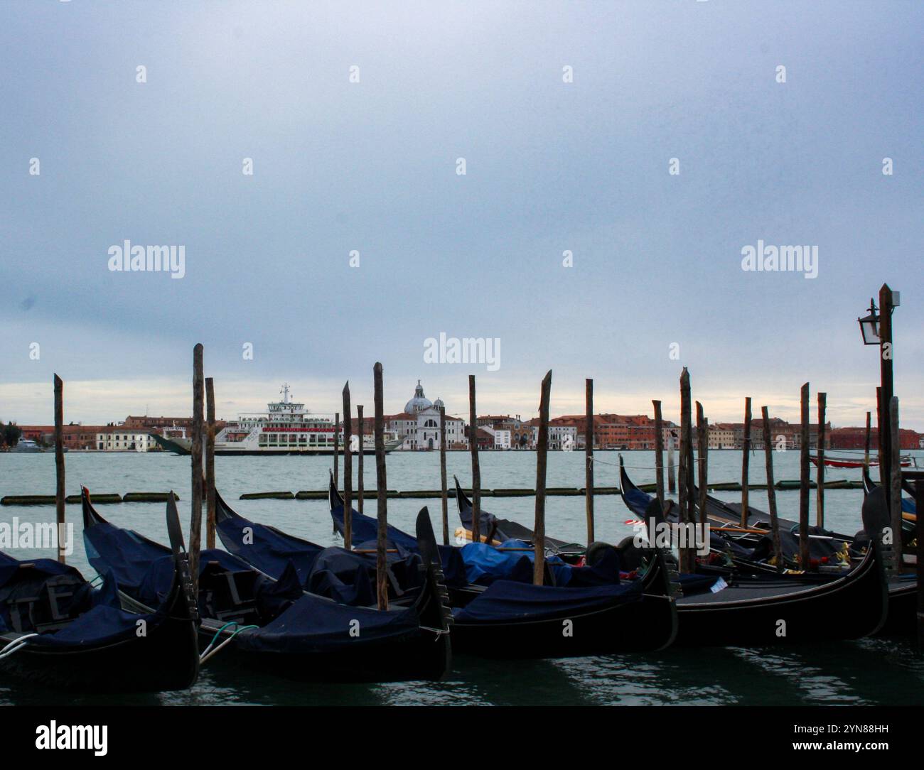 Gondolas in the foreground with the Basilica of San Giorgio in the ...