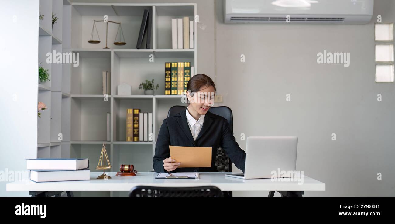 Lawyer Working in Organized Office with Justice Symbols Stock Photo - Alamy