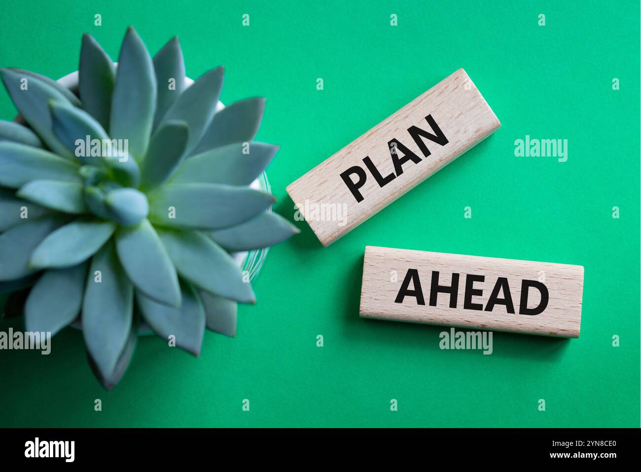 Plan ahead symbol. Wooden blocks with words Plan ahead. Beautiful green ...