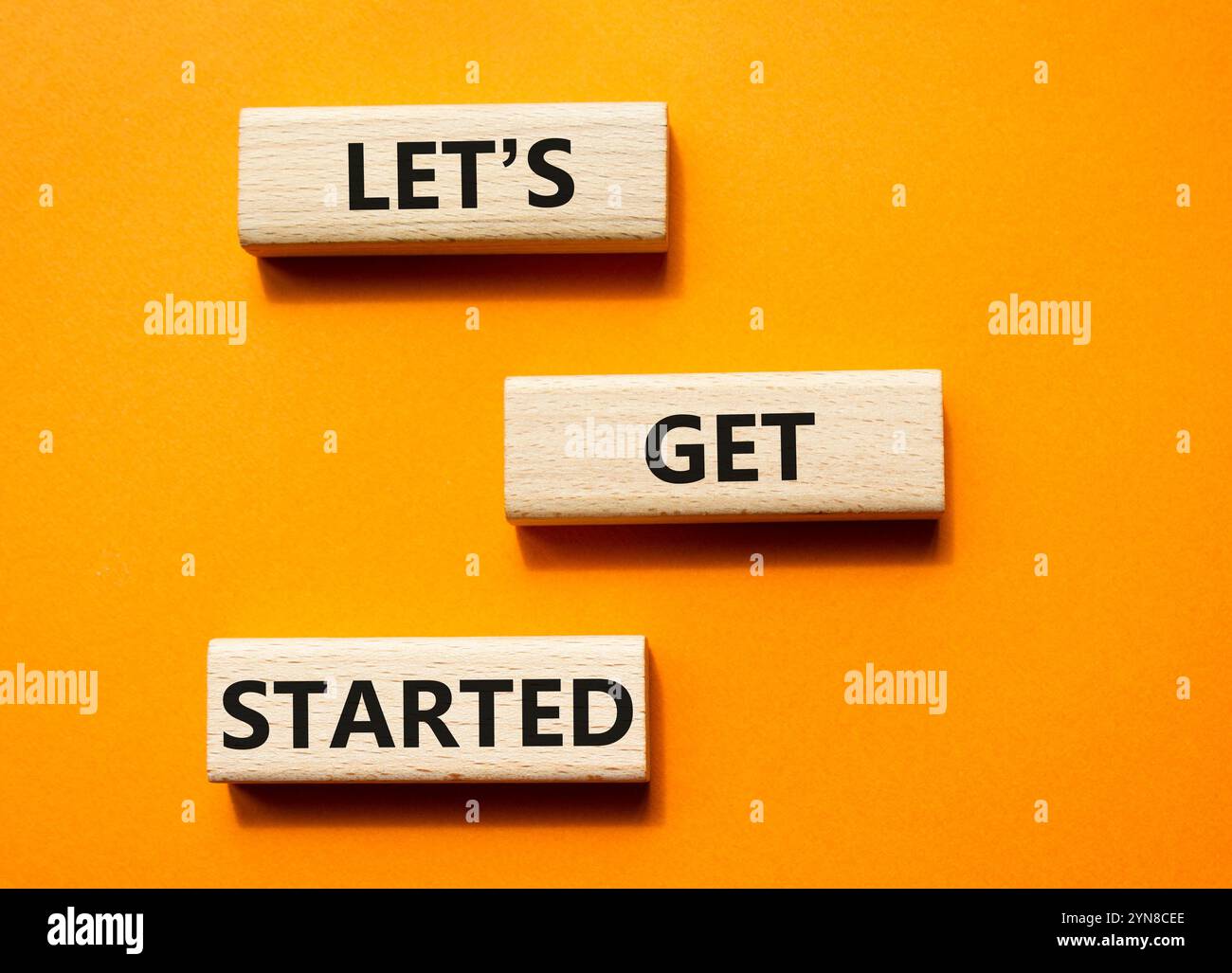 Lets get started symbol. Concept words Lets get started on wooden ...