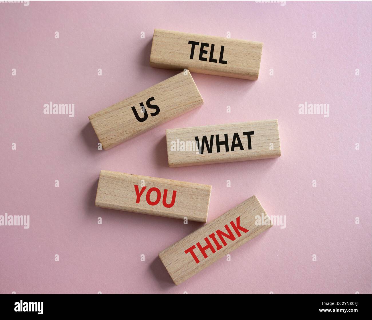 Tell us what you think symbol. Wooden blocks with words Tell us what ...