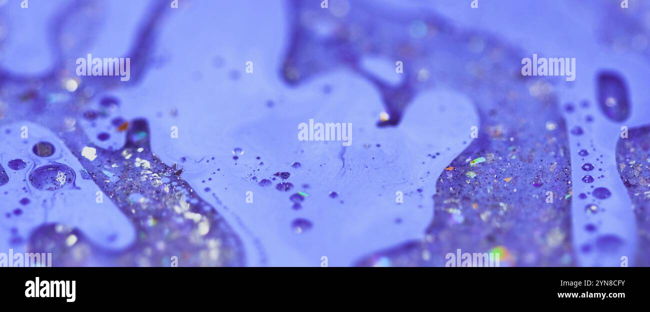 Paint liquid mix. Sparkling oil drip. Defocused purple color shiny ...