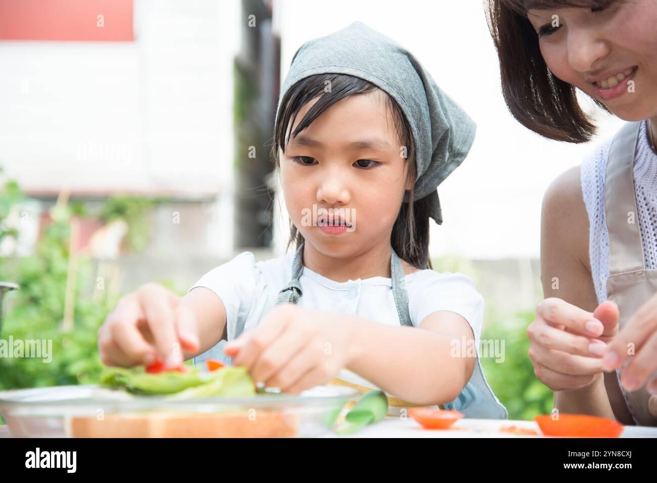 Parent and child making sandwich Stock Photo - Alamy