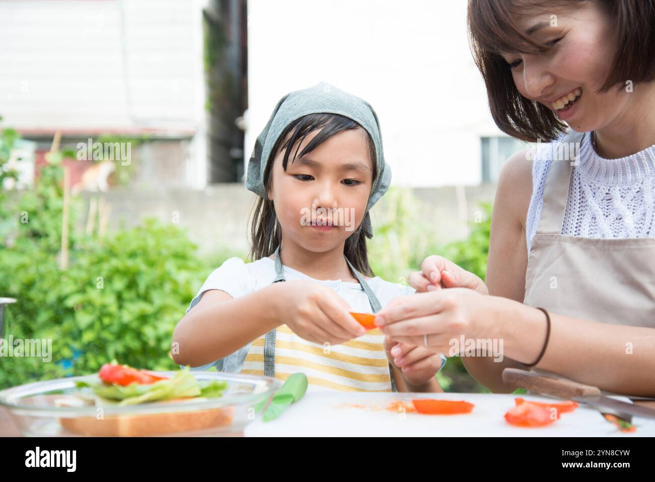 Parent and child making sandwich Stock Photo - Alamy