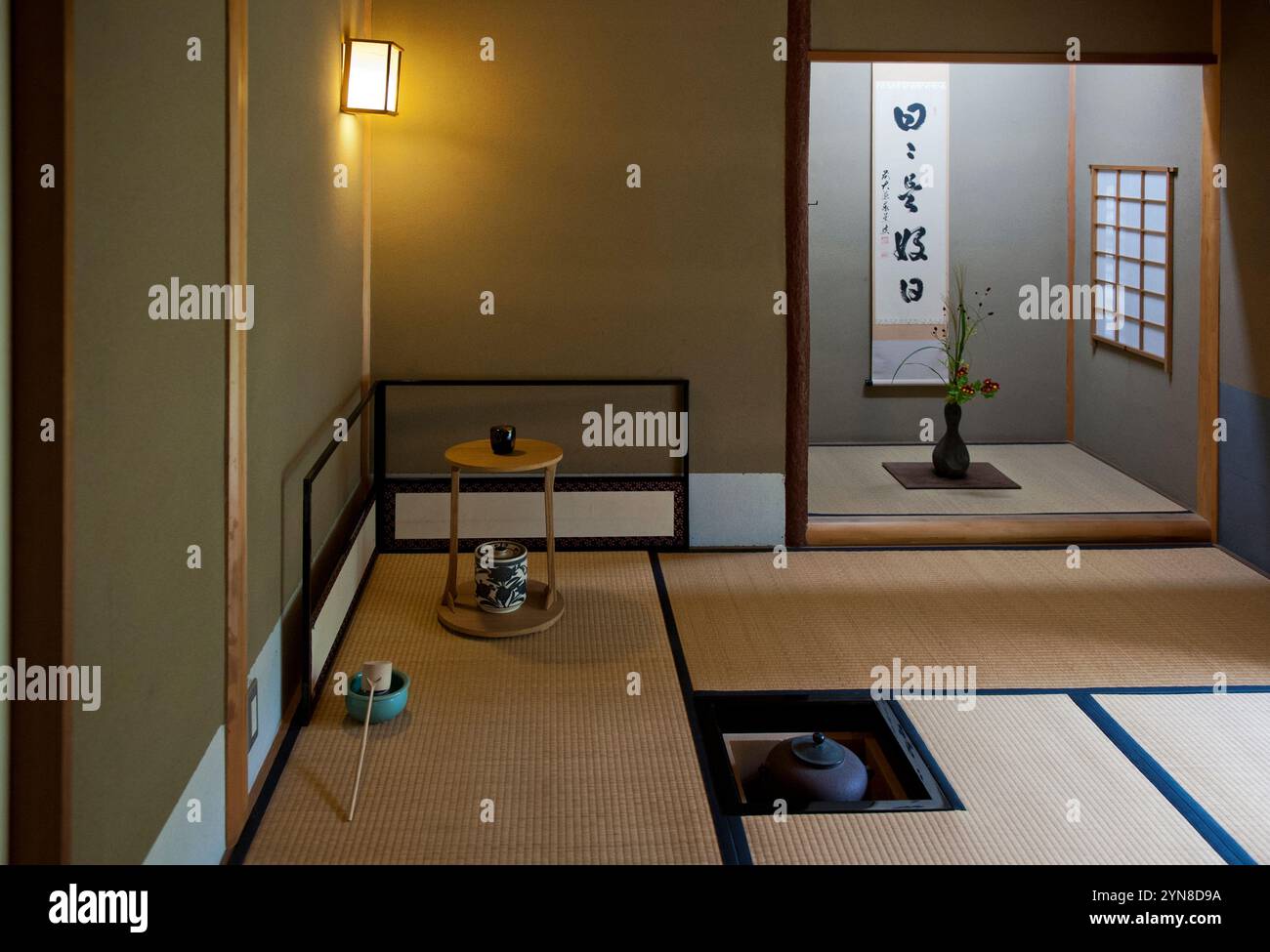 Interior view of a traditional Japanese chashitsu (tea room) with a tokonoma alcove, tatami ...