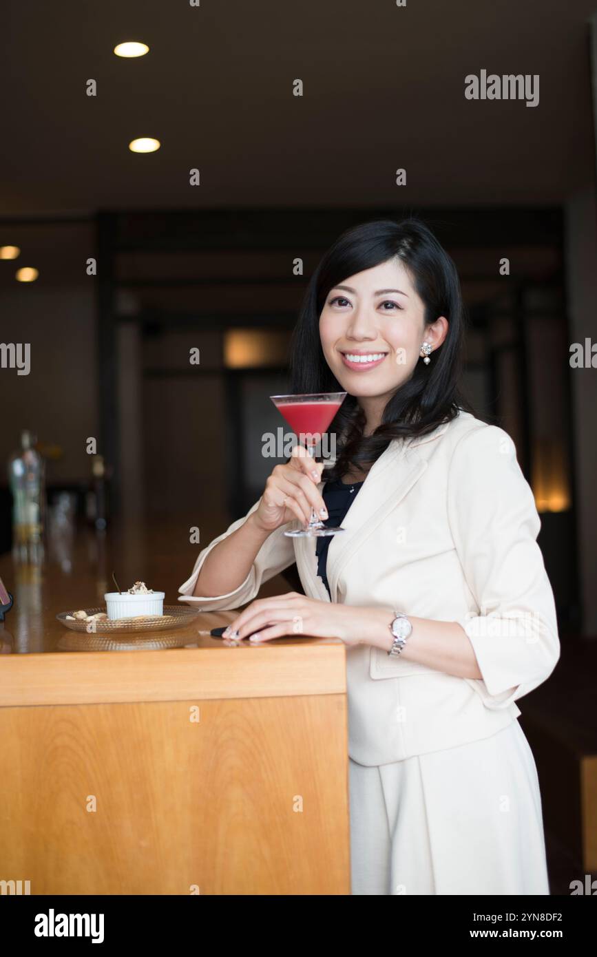 Woman alone at a bar hi-res stock photography and images - Alamy