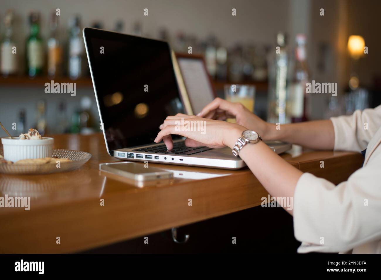 Woman working in a bar hi-res stock photography and images - Alamy