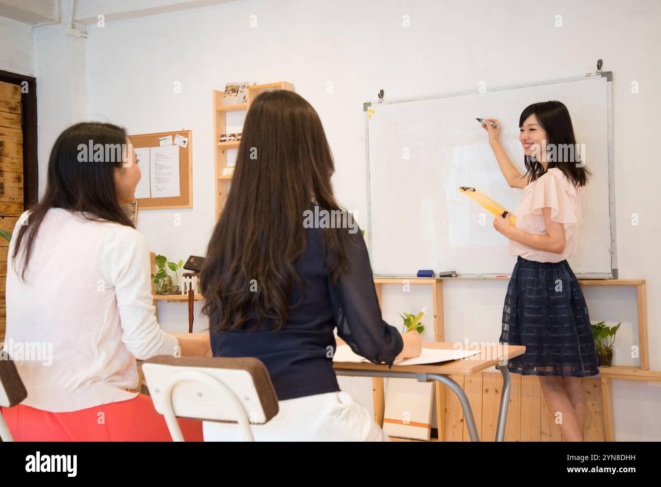 Women taking a lecture Stock Photo - Alamy