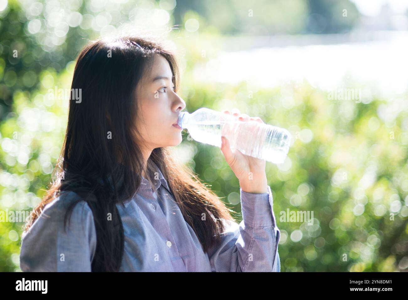 Woman drinking water Stock Photo - Alamy