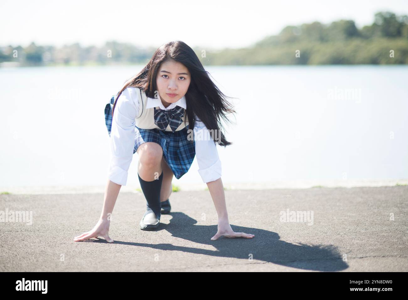 High school girl in school uniform posing for a position Stock Photo ...