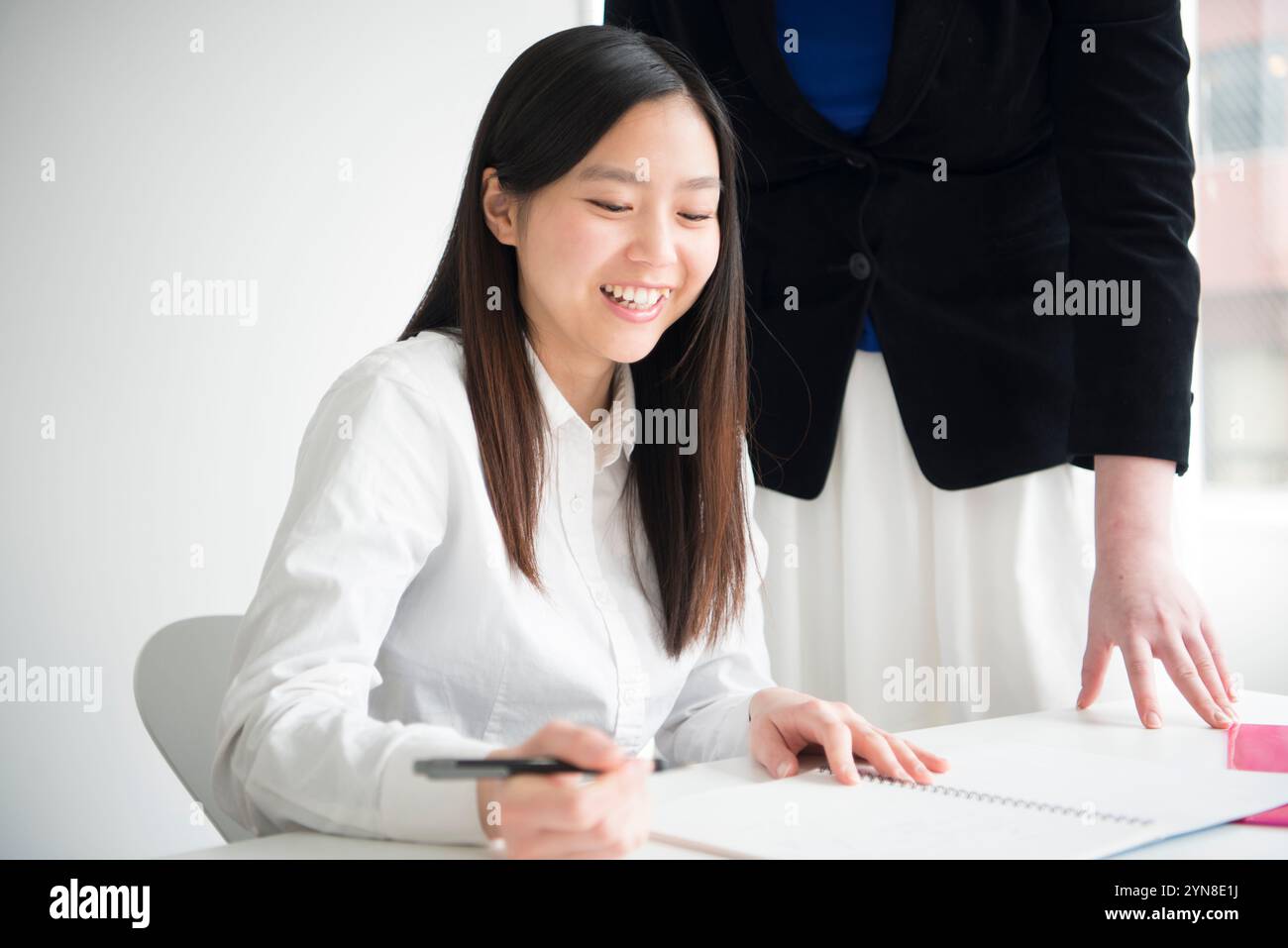 Woman being taught to study Stock Photo - Alamy