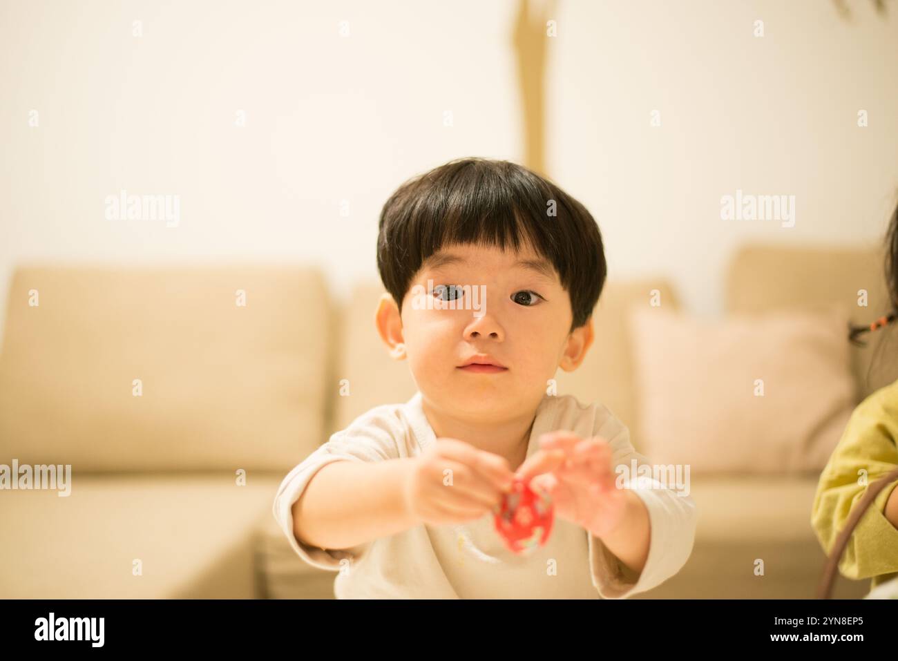 Boy playing with a cueball Stock Photo - Alamy