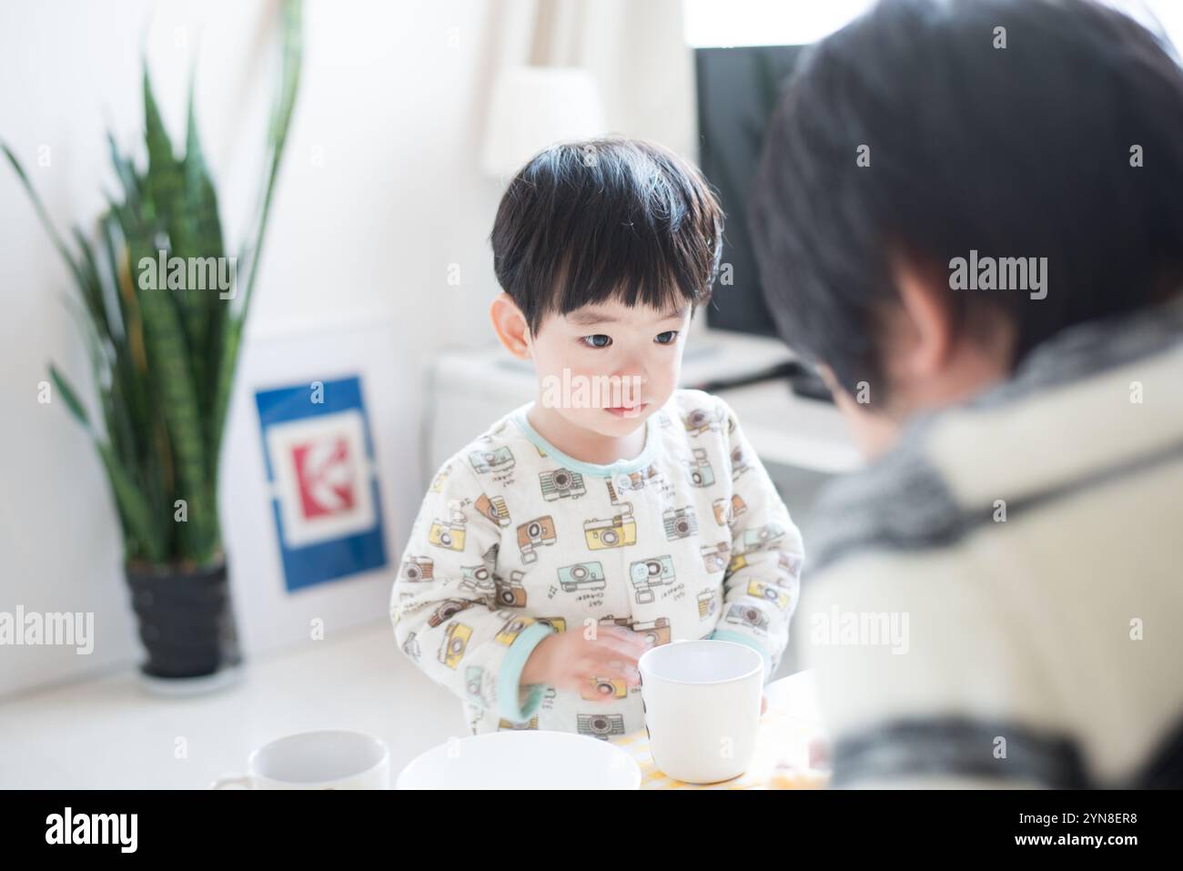 Boy eating breakfast Stock Photo - Alamy