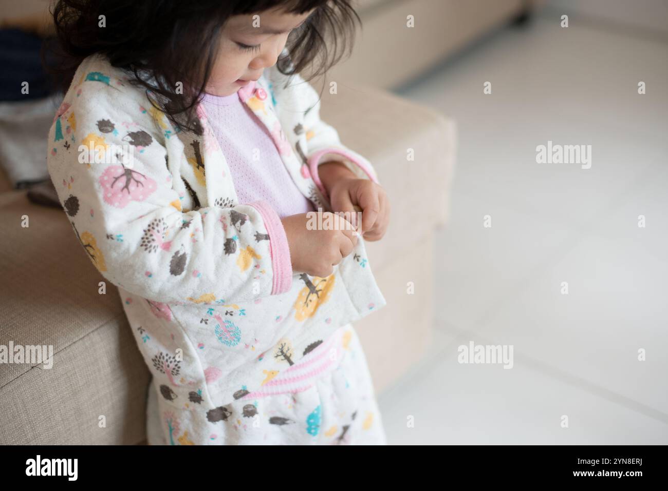 Girl changing clothes alone Stock Photo - Alamy