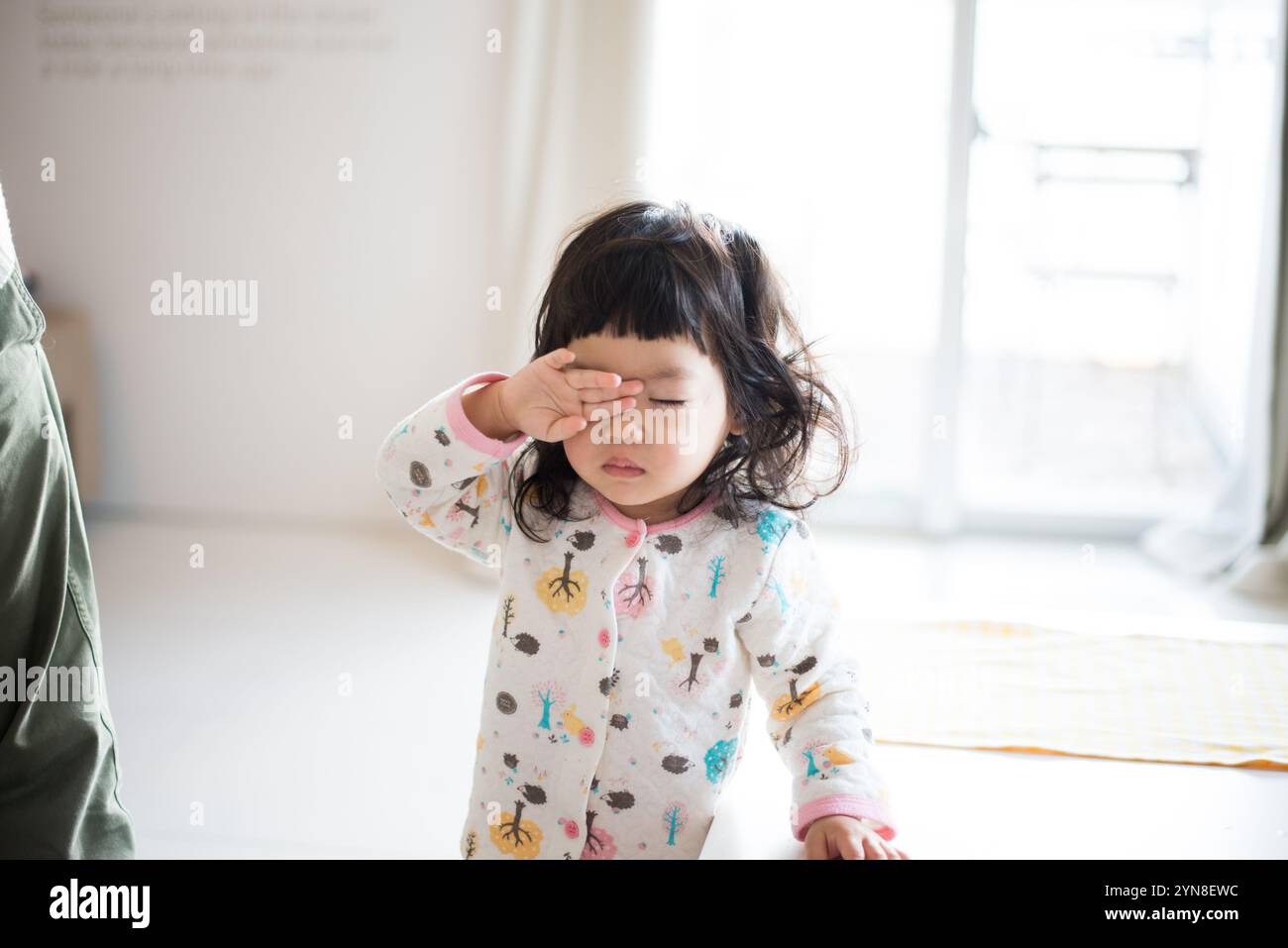 Girl waking up in bed Stock Photo - Alamy