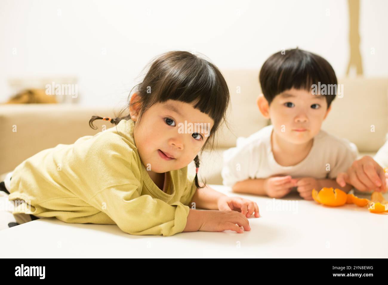 Boy eating mandarin hi-res stock photography and images - Alamy