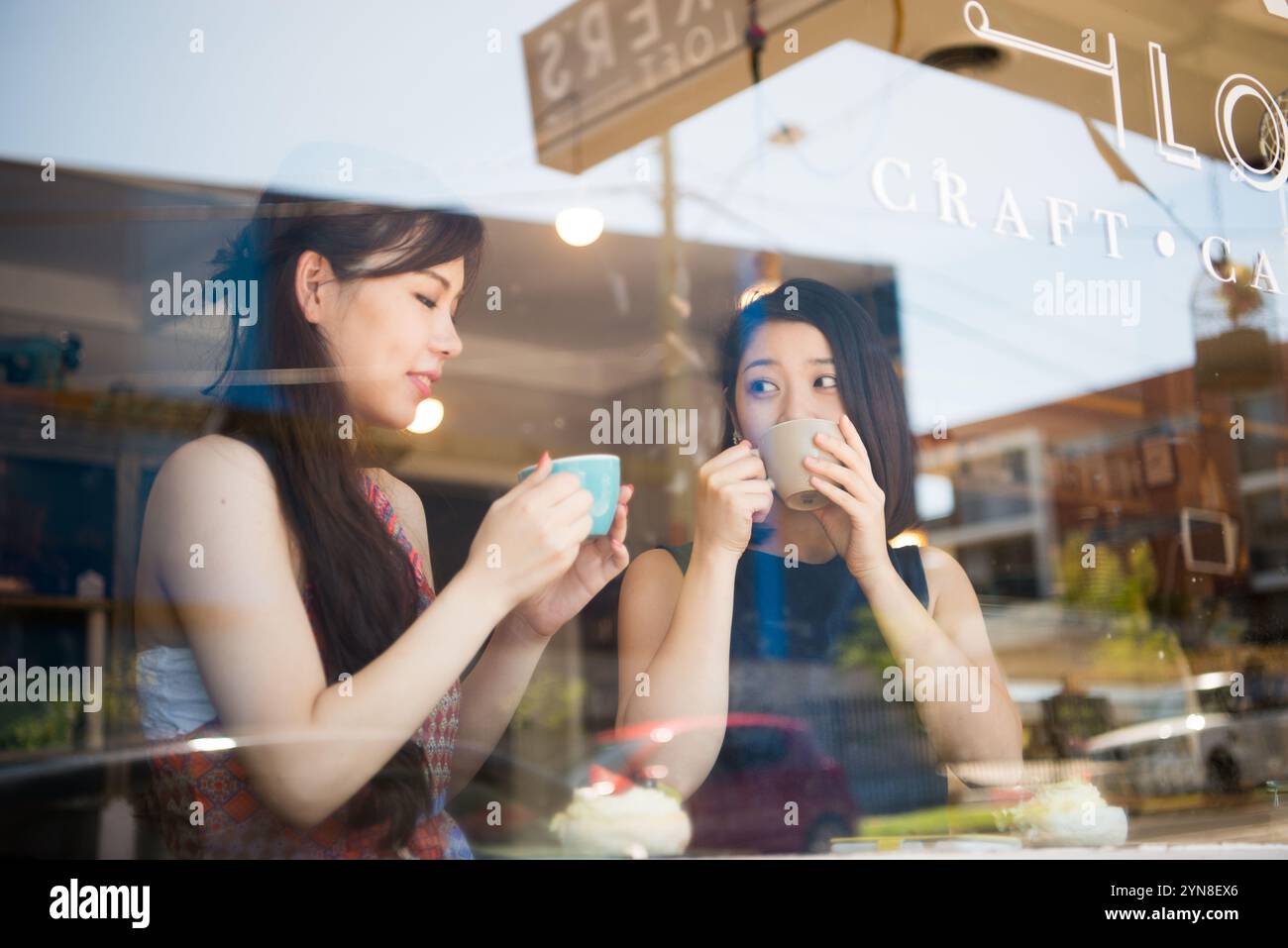 Two people having tea at a café Stock Photo - Alamy