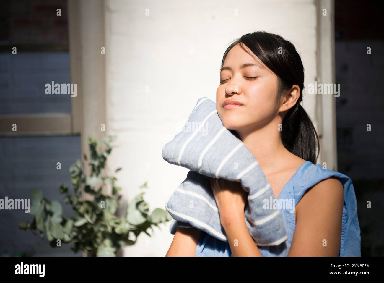 Woman wiping face with towel hi-res stock photography and images - Alamy