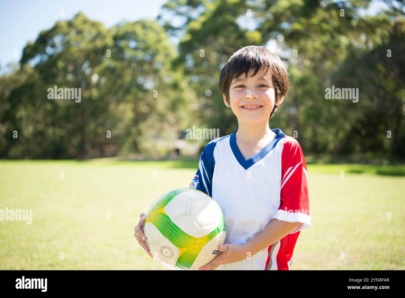 Boy with football Stock Photo - Alamy