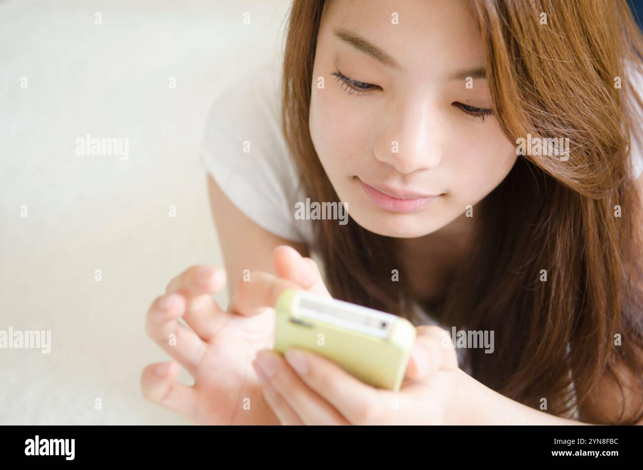 Woman looking at her phone Stock Photo - Alamy