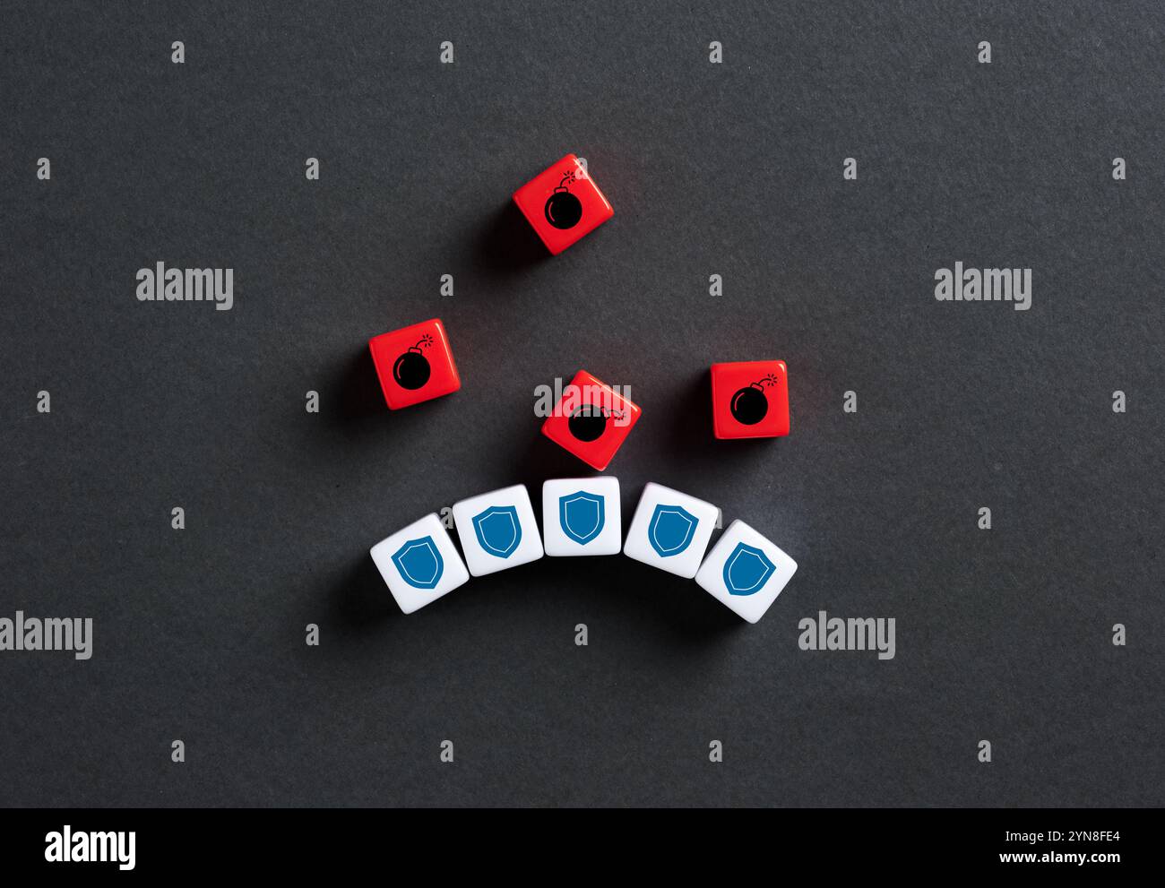 Red dice showing bombs falling on blue dice showing shields ...